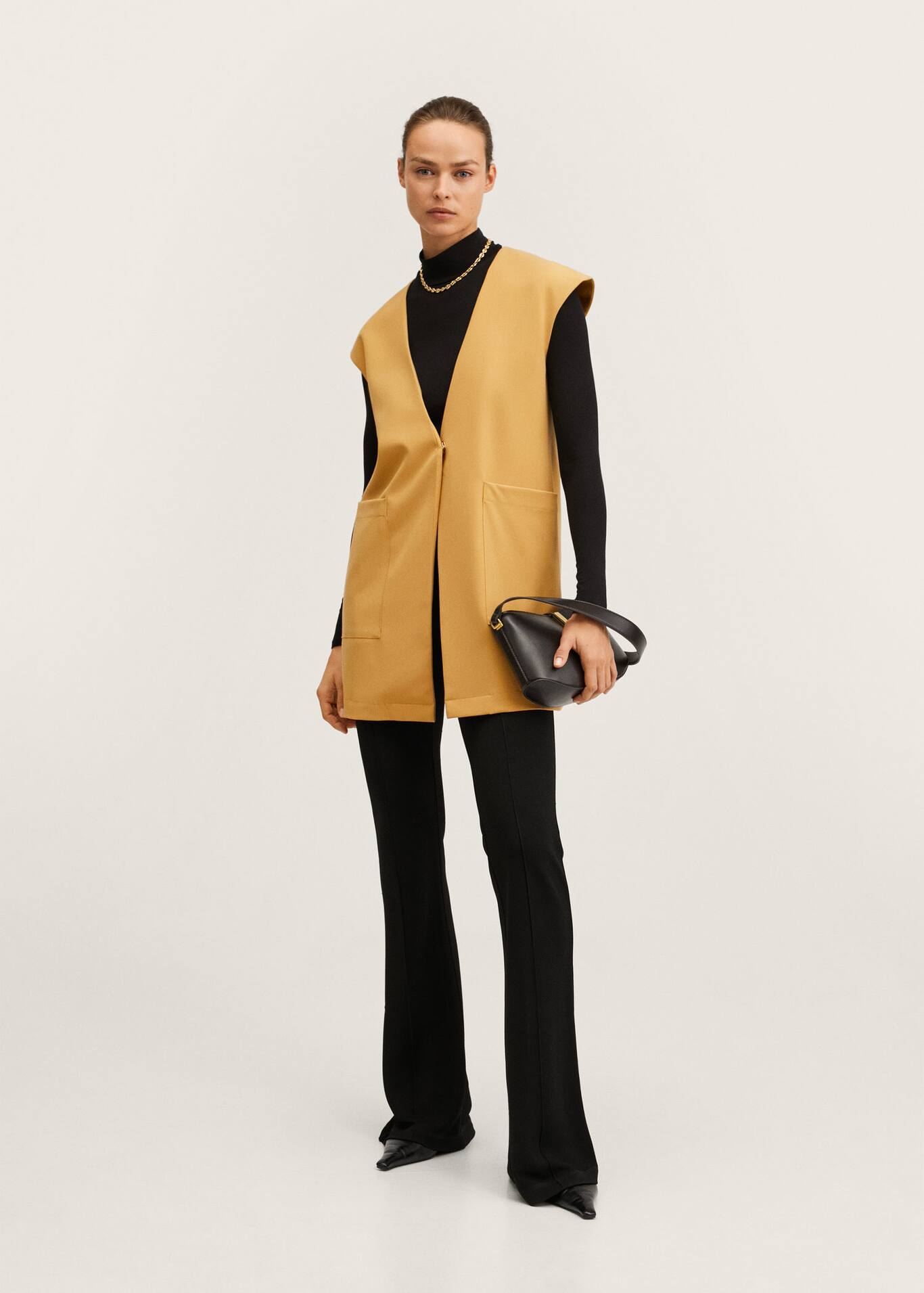 Oversized gilet with pockets - Woman | MANGO OUTLET Lithuania